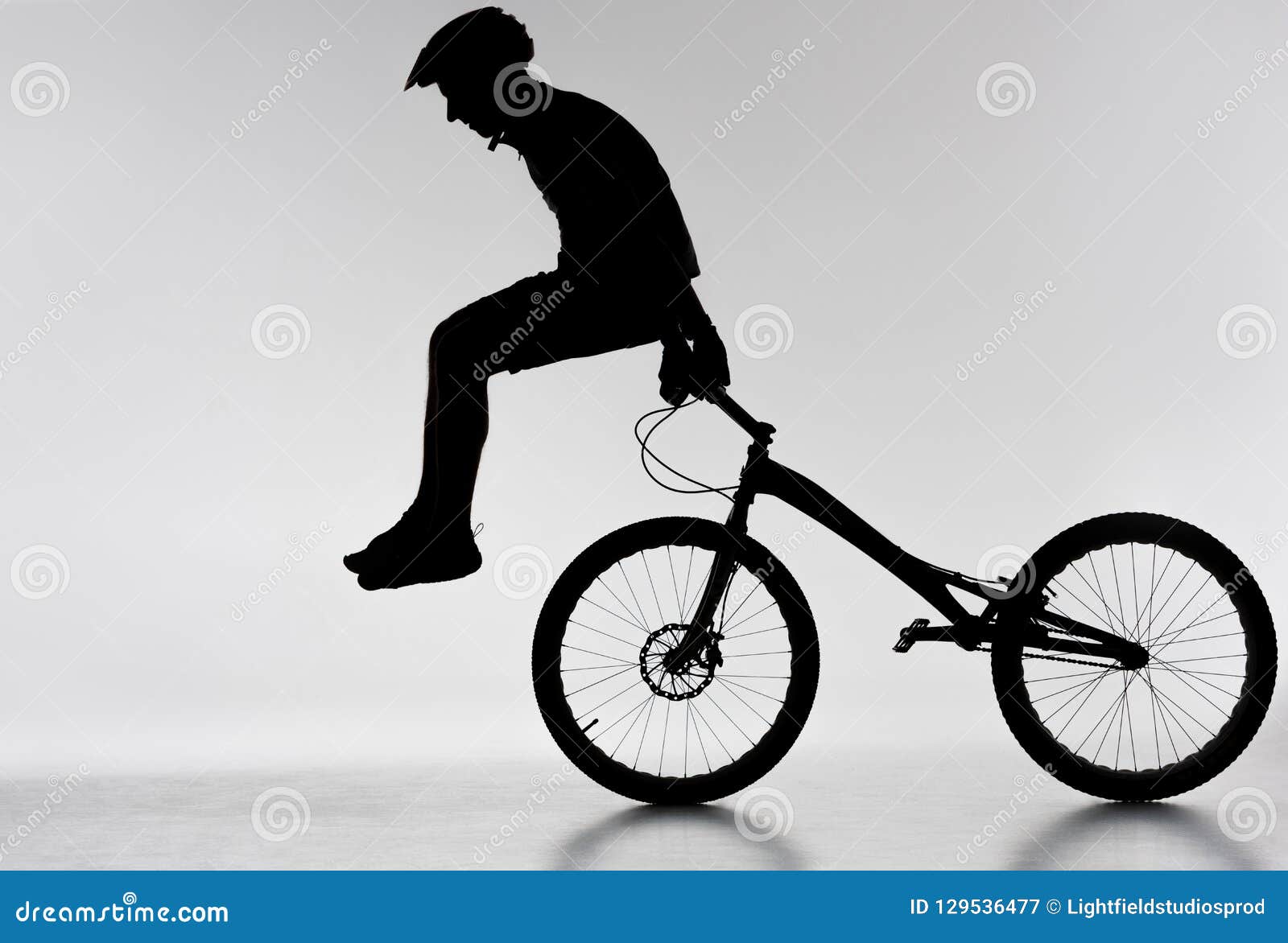 Silhouette of Trial Biker Performing Stunt on Bicycle Stock Image ...