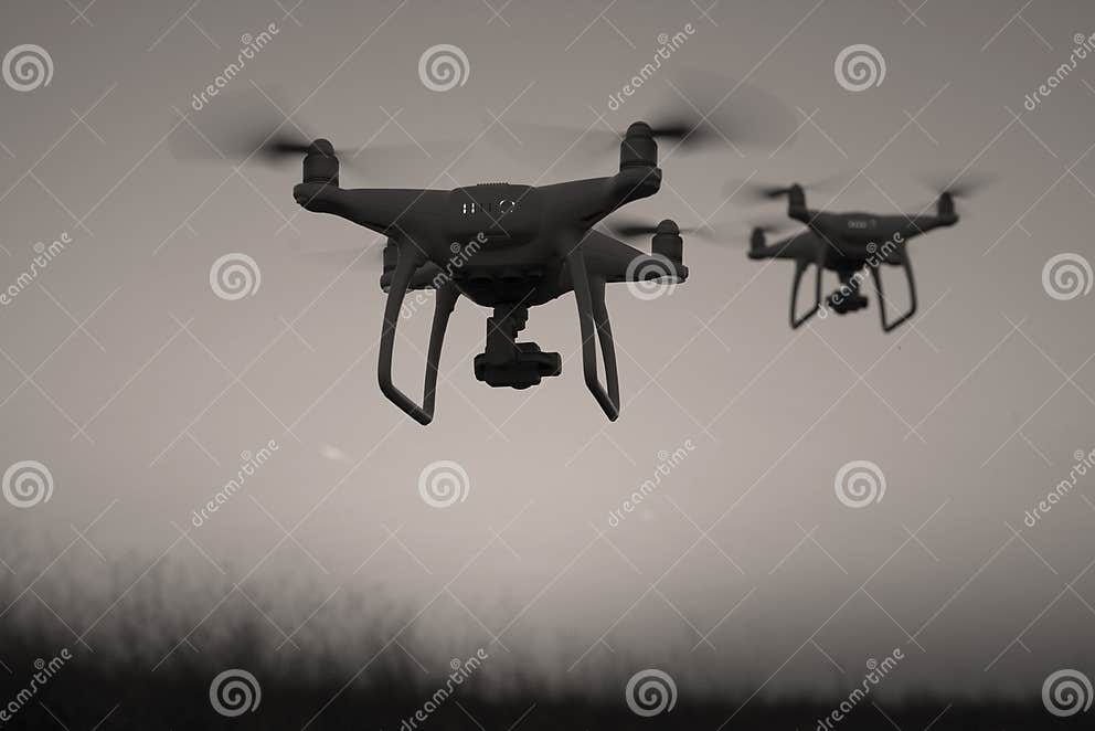 Silhouette of Two Drones in the Sky Stock Photo - Image of aerial ...