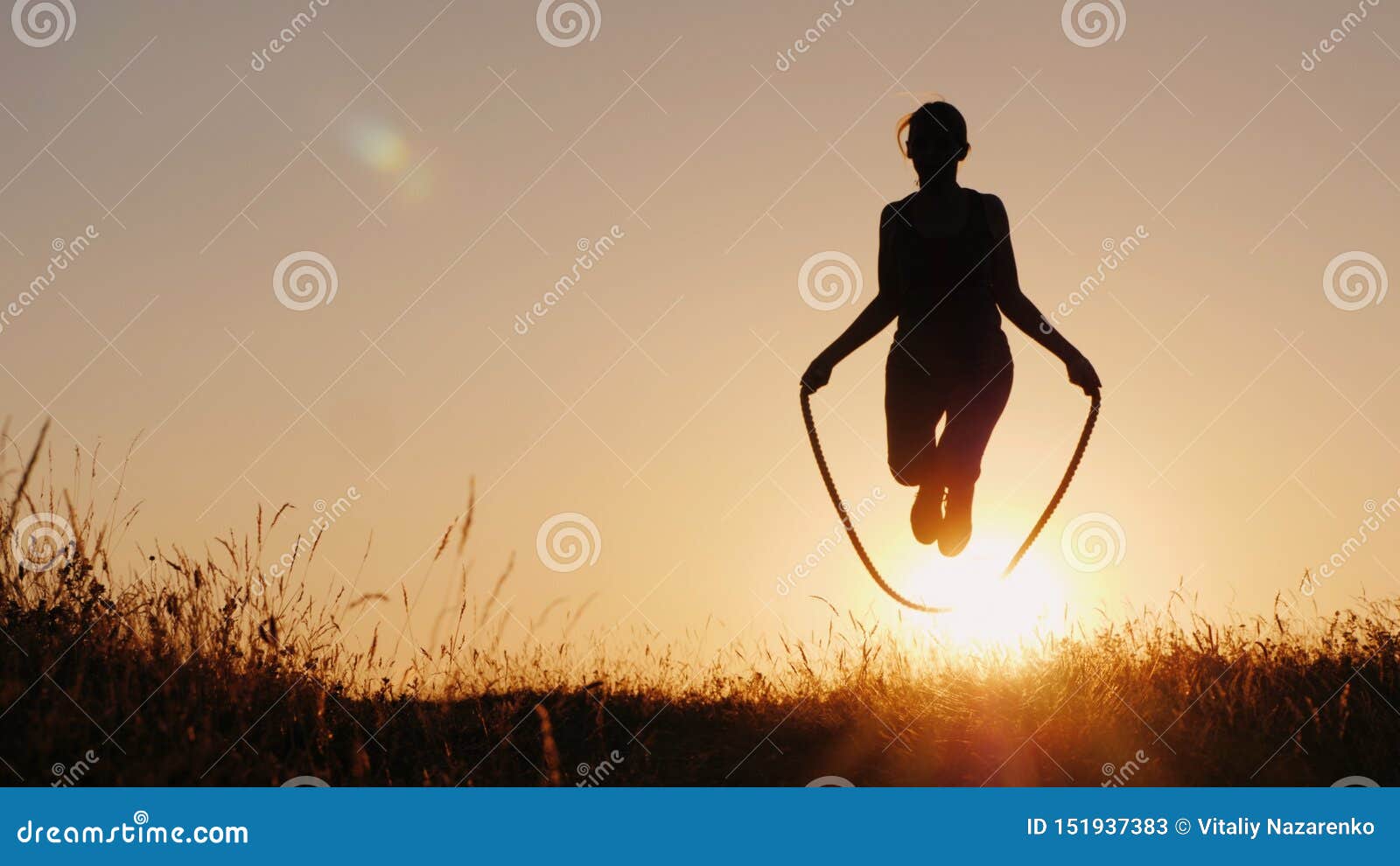 Silhouette of a Woman - Jumping through the Rope at Sunset Stock Image ...