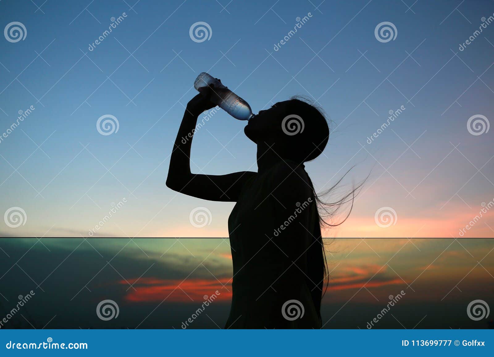 Silhouette of Woman Rehydrate and Refresh at Sunset Stock Image - Image ...