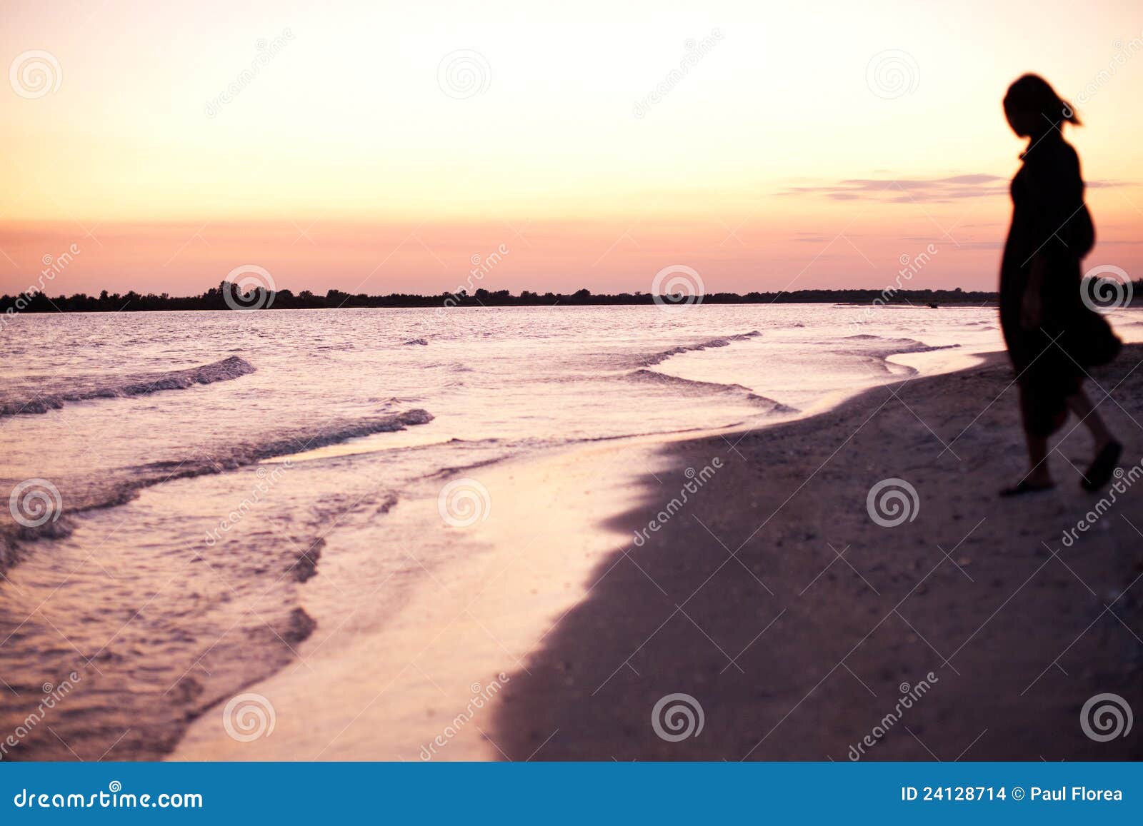Silhouette of Woman on Seashore at Sunset Stock Photo - Image of ...