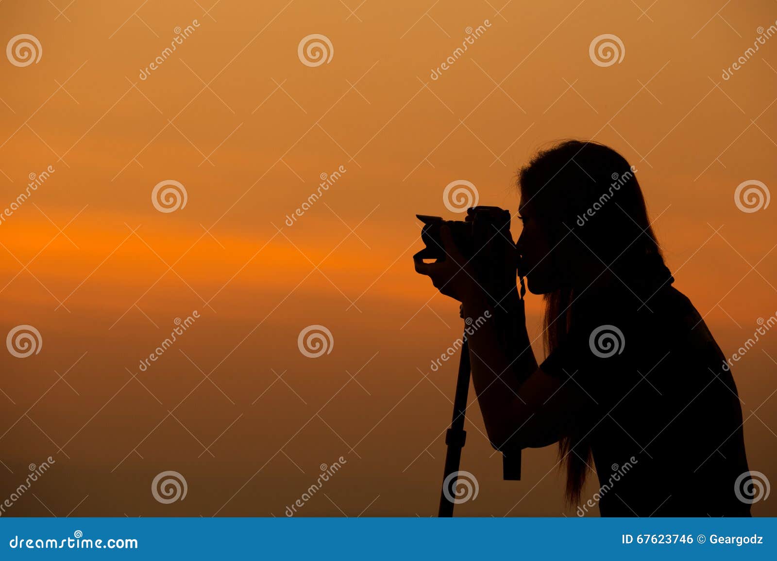 Silhouette of Woman Shooting with Camera at Sunset Stock Photo - Image ...