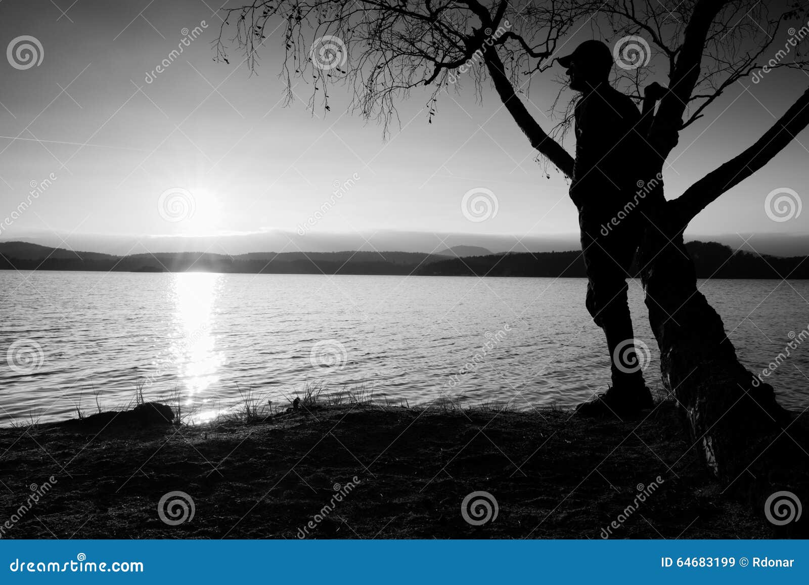 Silhouette of Young Man Stand on Beach at Sunset. Shadow of Active Man ...