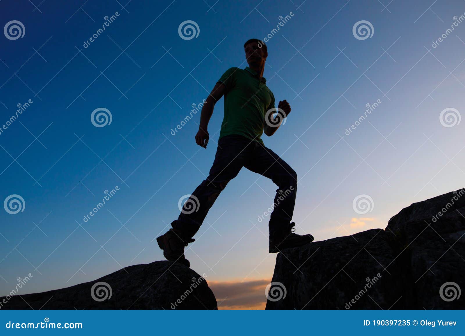 Silhouette of a Young Man Stepping Over a Gorge Stock Image - Image of ...