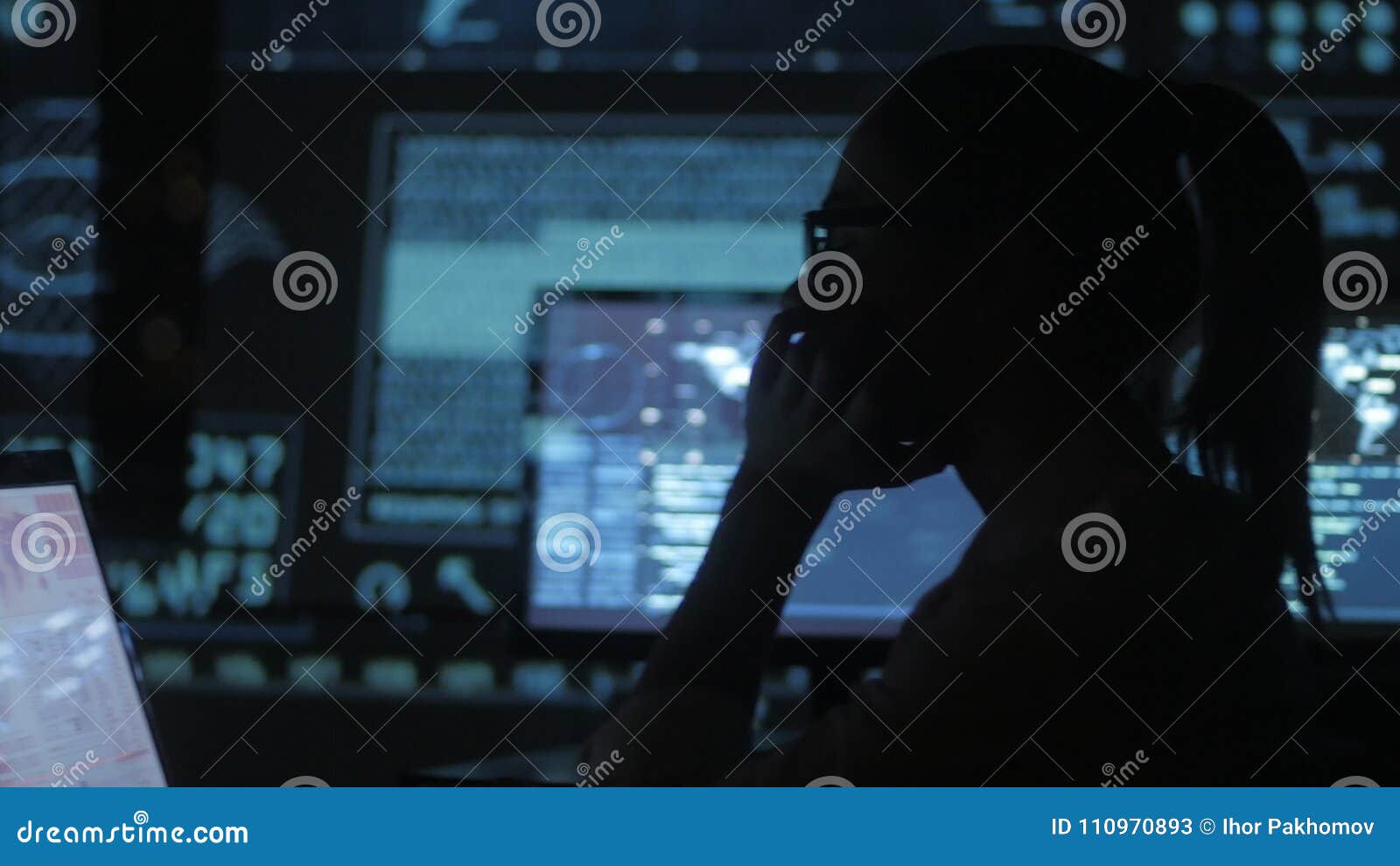Silhouette of Young Woman it Programmer Working at a Computer in the ...