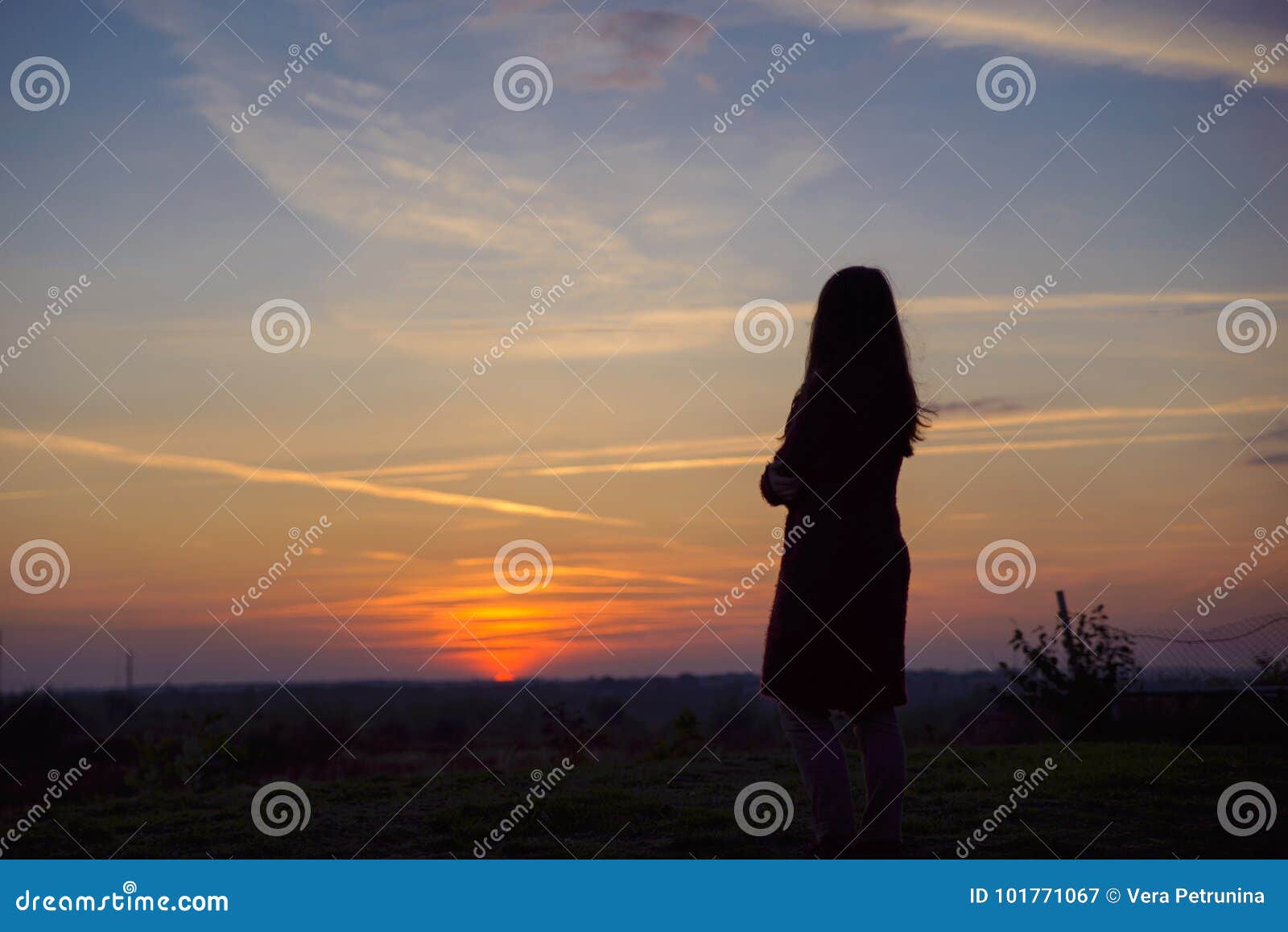 Silhouette of a Young Woman Standing on Sunset Stock Image - Image of ...