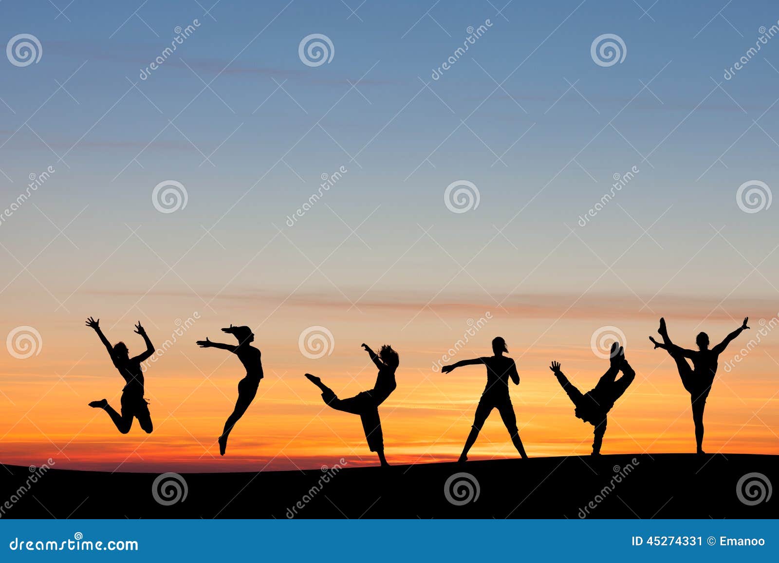 Silhouetted Group Tumbling and Dancing in Sunset Stock Image - Image of ...