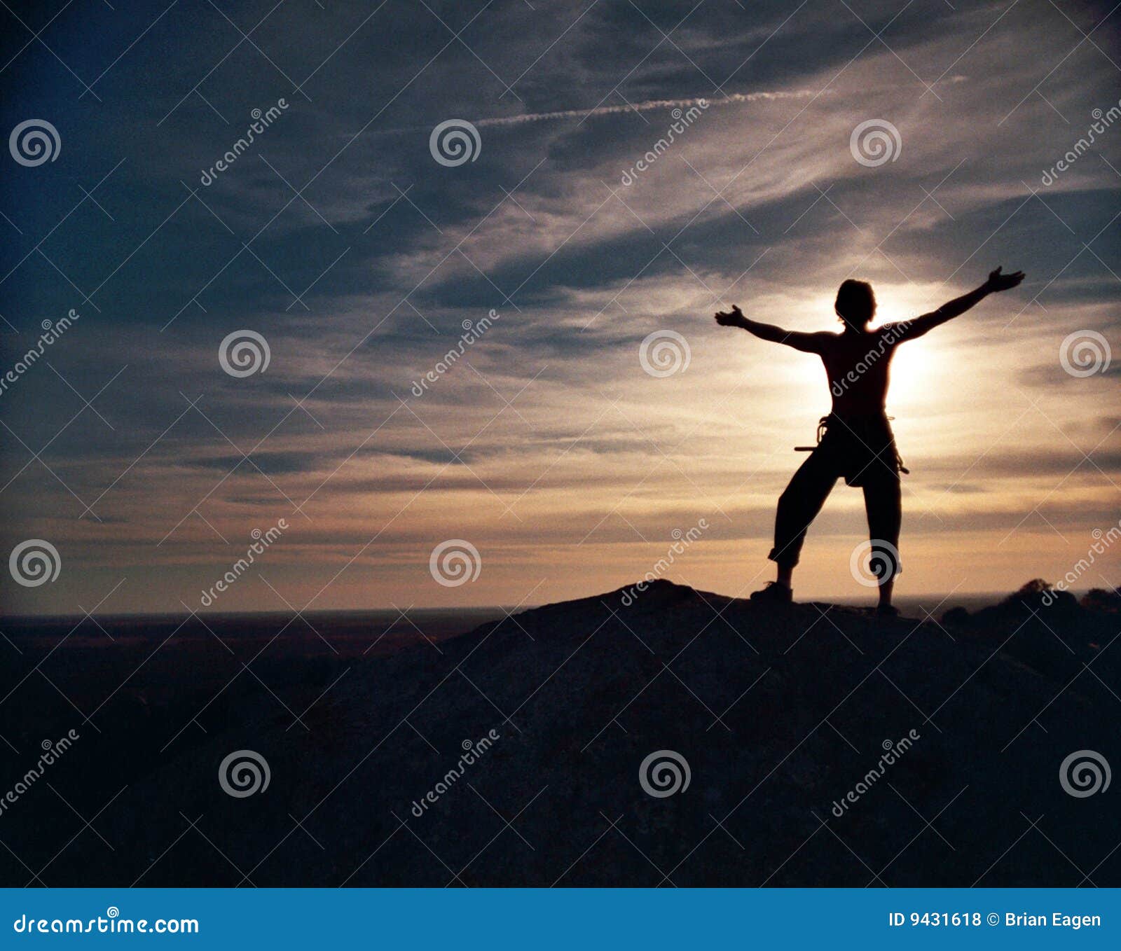 Silhouetted Man stock photo. Image of sunset, nature, clouds - 9431618