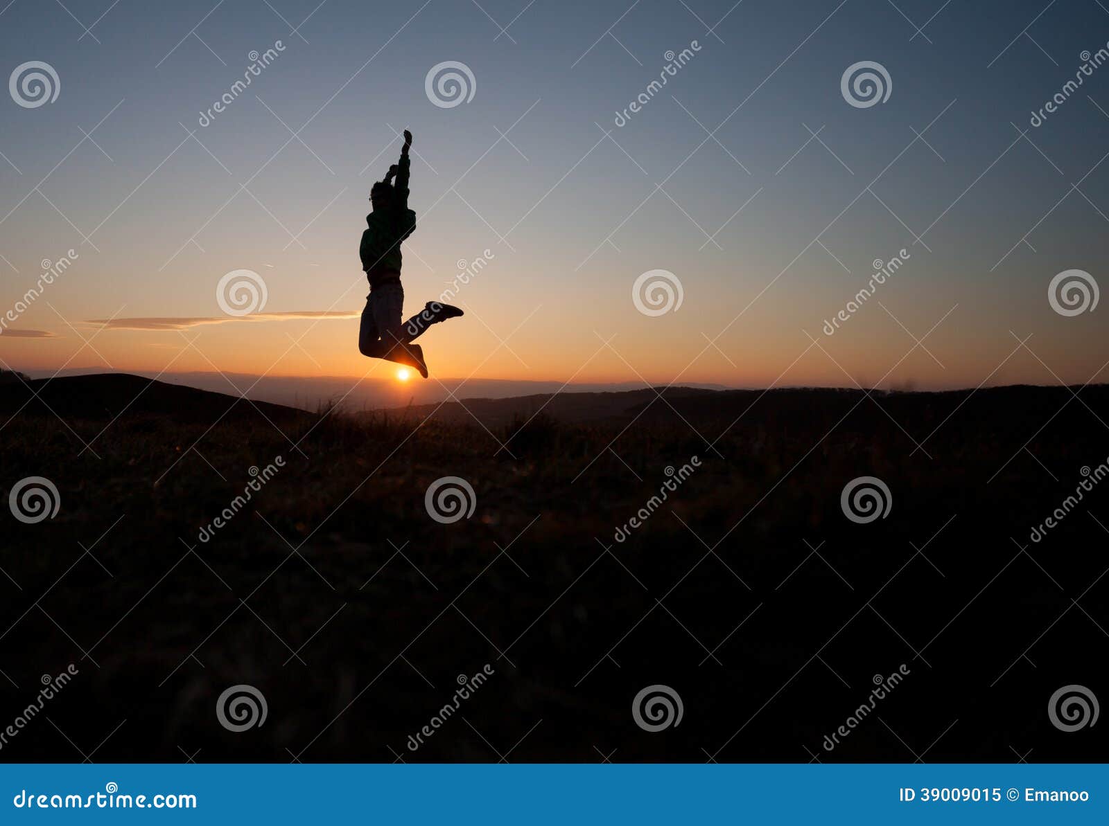 Silhouetted Man Jumping in Sunset Stock Image - Image of arms ...