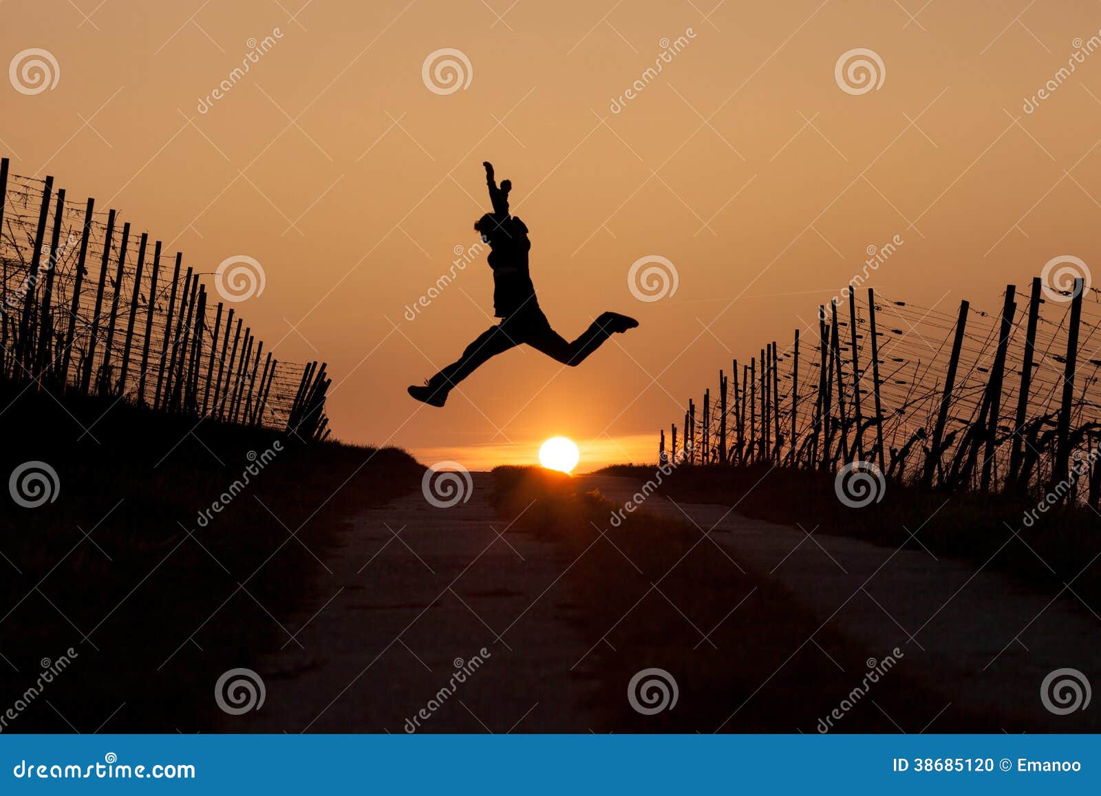 Silhouetted Man Leaping in Sunset Stock Photo - Image of healthy ...