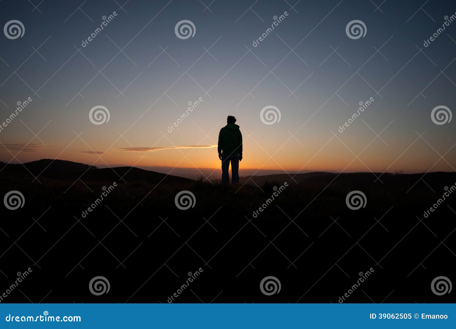 Silhouetted Man Standing in Sunset Stock Image - Image of achievement ...