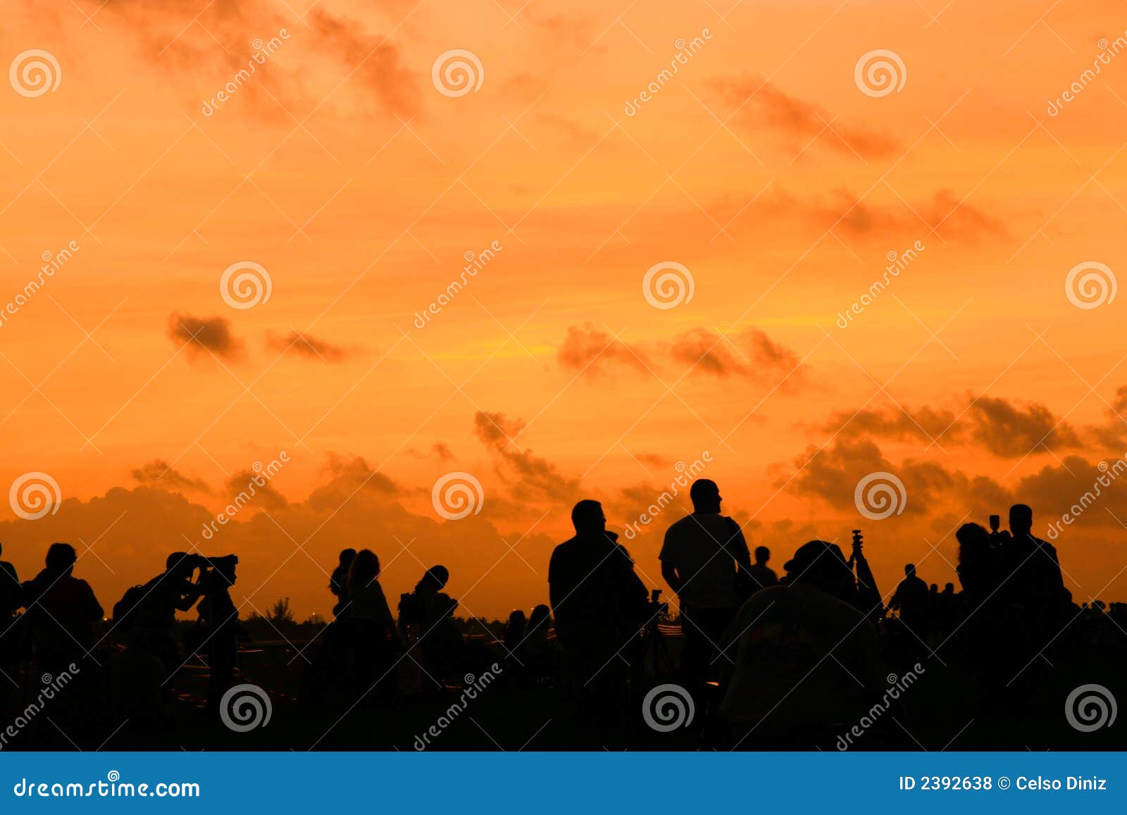 Crowd at sunset stock photo. Image of fall, setting, clouds - 2392638