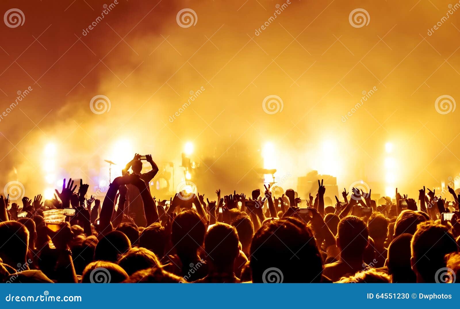 The Silhouettes Of Concert Crowd In Front Of Bright Stage Lights ...