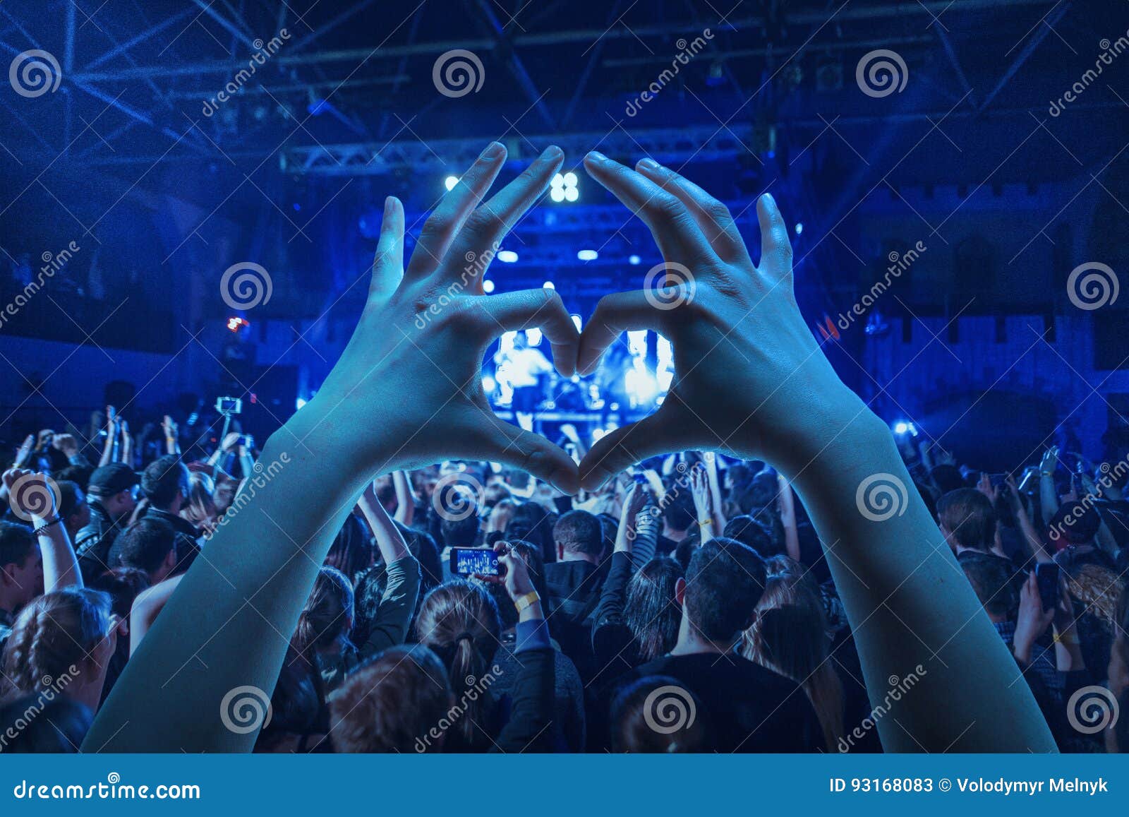The Silhouettes of Concert Crowd in Front of Bright Stage Lights Stock ...
