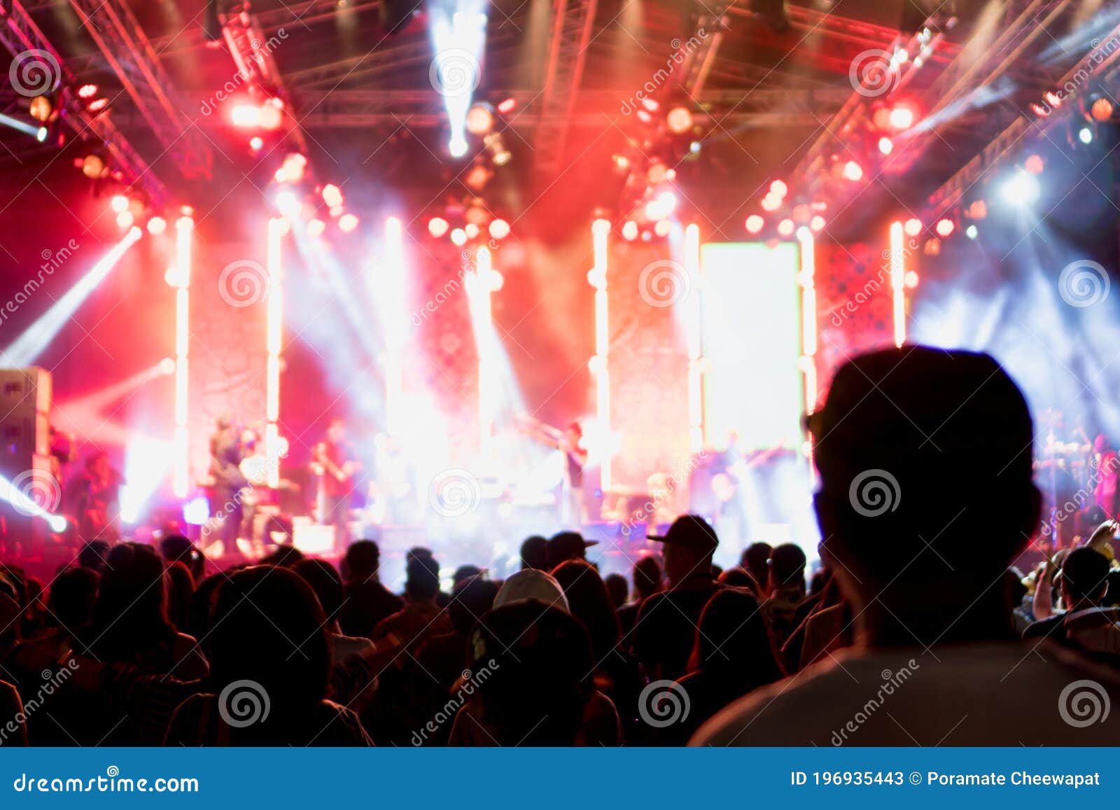 The Silhouettes Of Concert Crowd In Front Of Bright Stage Lights ...