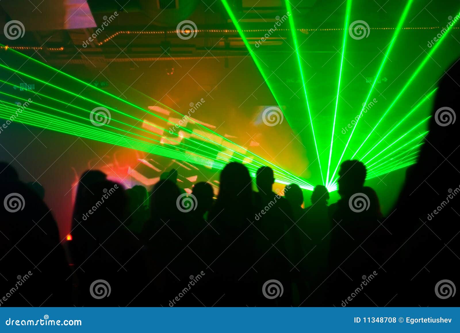 Silhouettes of Dancing People in Green Laser Light Stock Photo - Image ...