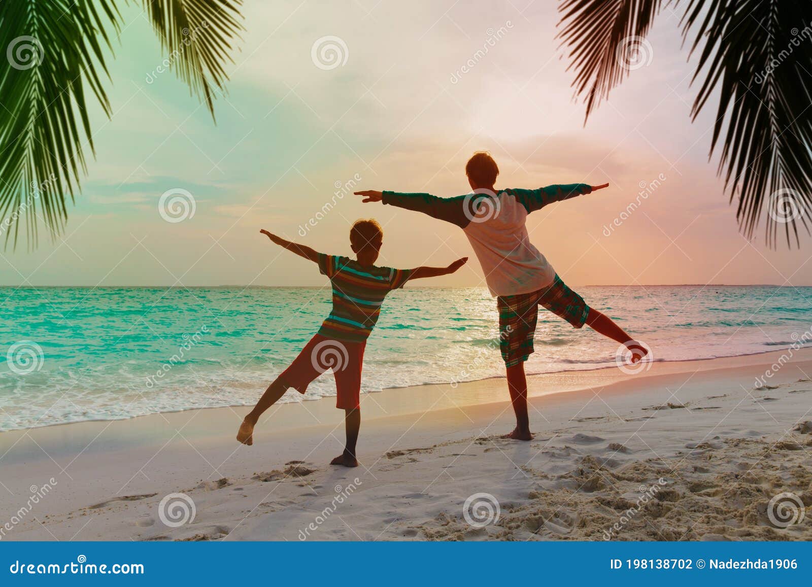 Silhouettes of Father and Son Having Fun at Sunset Stock Photo - Image ...