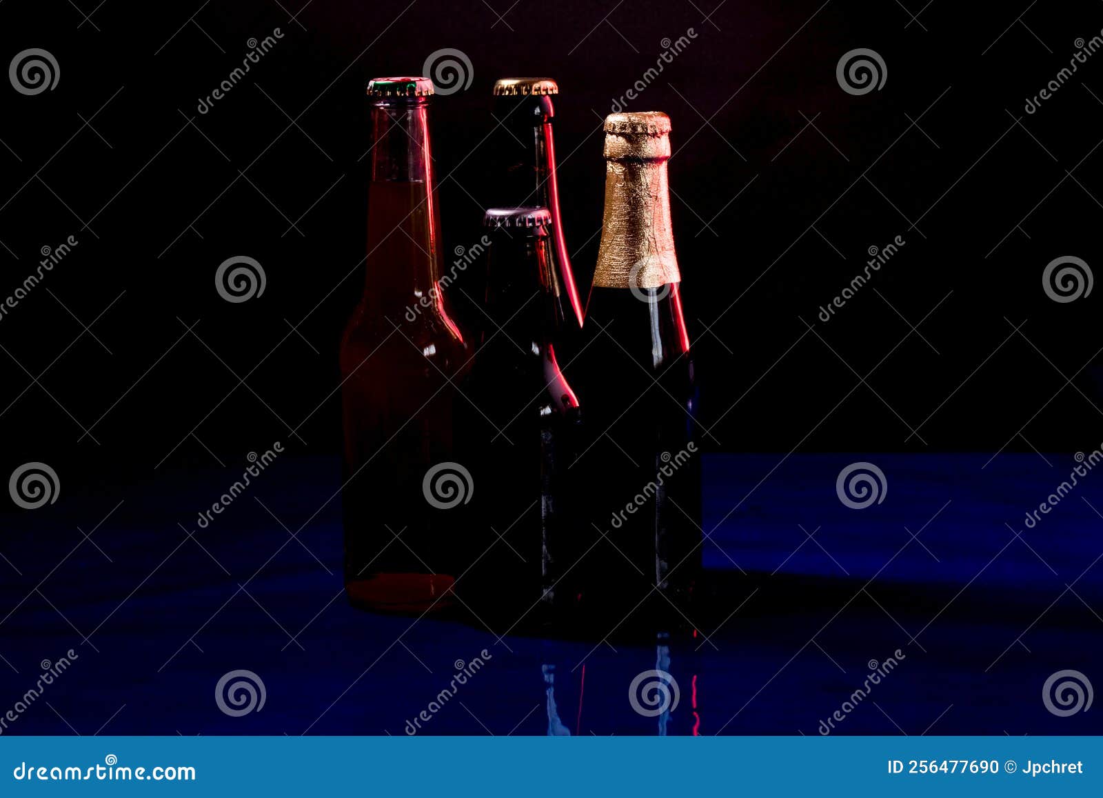 Silhouettes of Four Beer Bottles on a Black Background, Placed on a ...