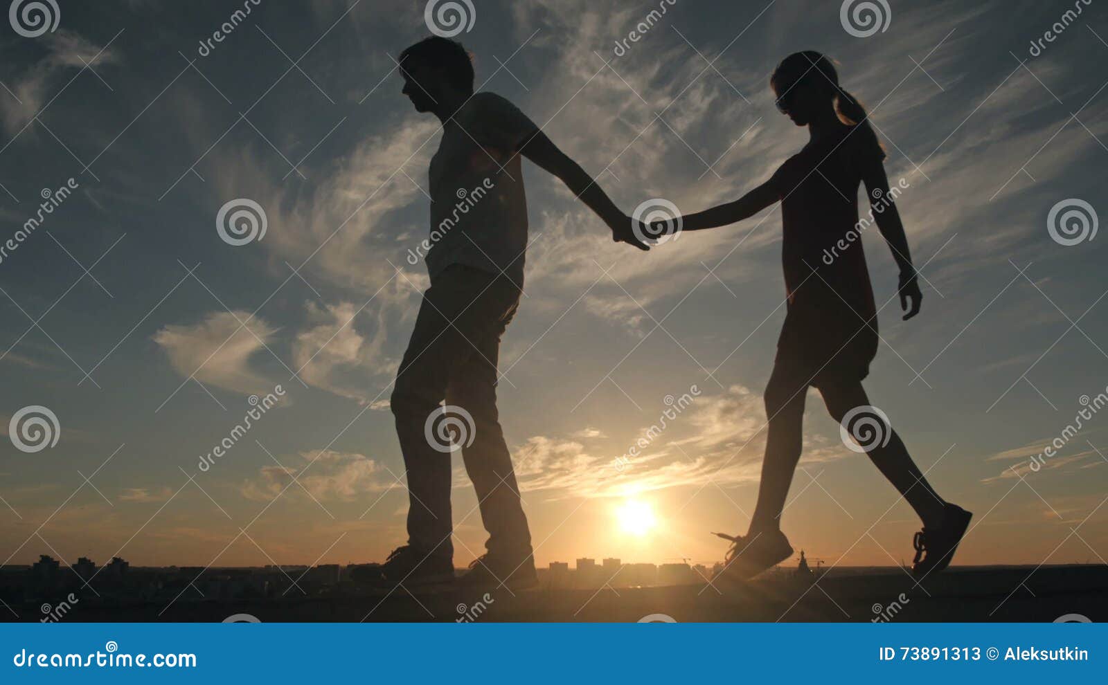 Silhouettes of Happy Couple Running Down at Sunset Stock Video - Video ...