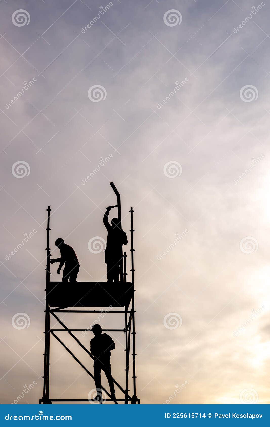 Silhouettes of Installation Workers Installing Metal Structures Against ...