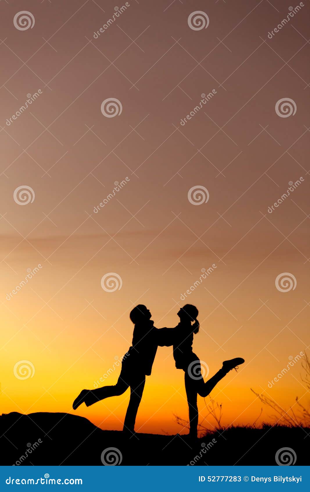 Silhouettes Of Mother And Daughter At The Beautiful Sunset Dusk Stock