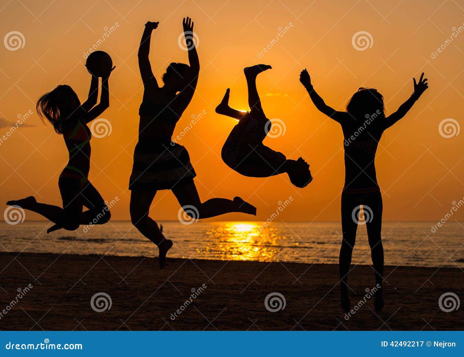 Silhouettes of a People Having Fun on a Beach Stock Image - Image of ...