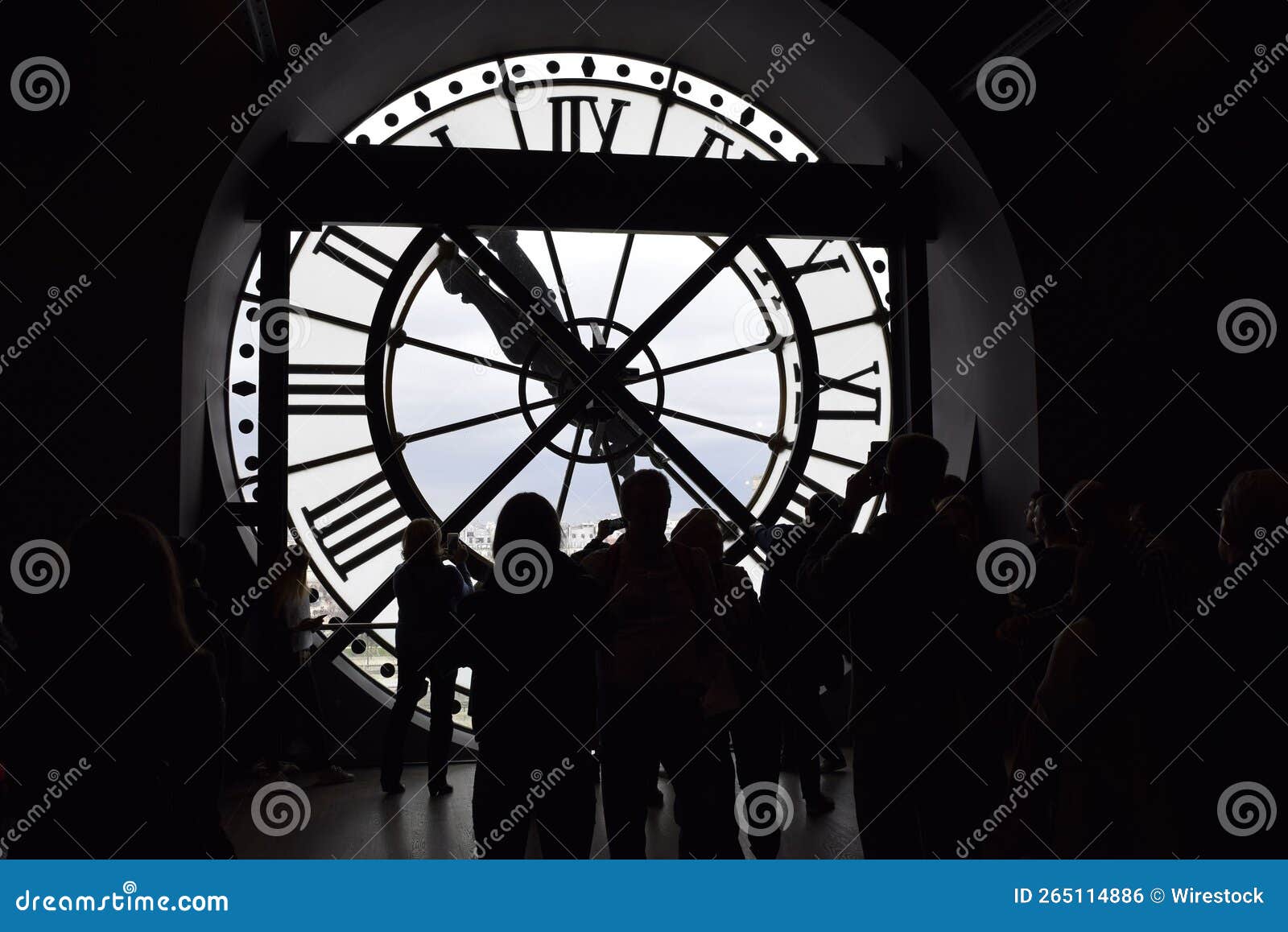Silhouettes of People Inside a Clock Tower with the Big Clock in the ...