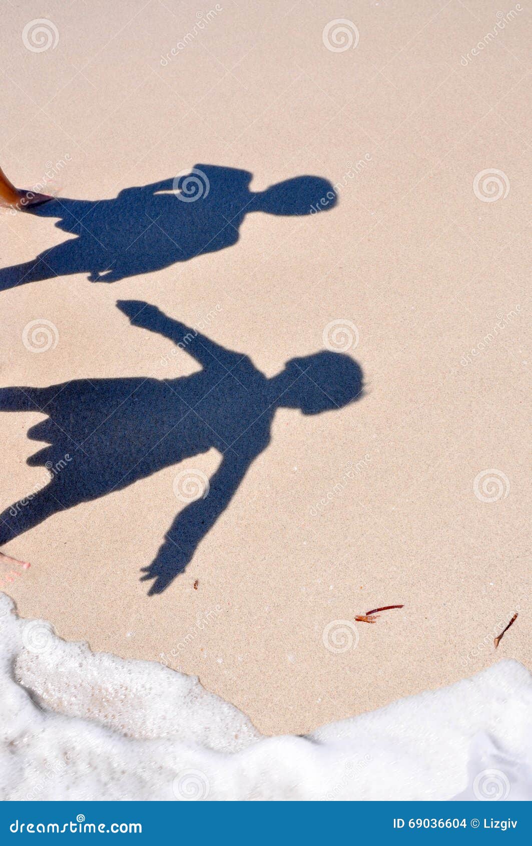 Silhouettes in Sand stock photo. Image of shadow, shape - 69036604