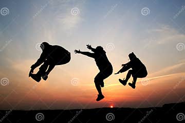 Silhouettes of Three Men Jumping Stock Image - Image of high, emotion ...