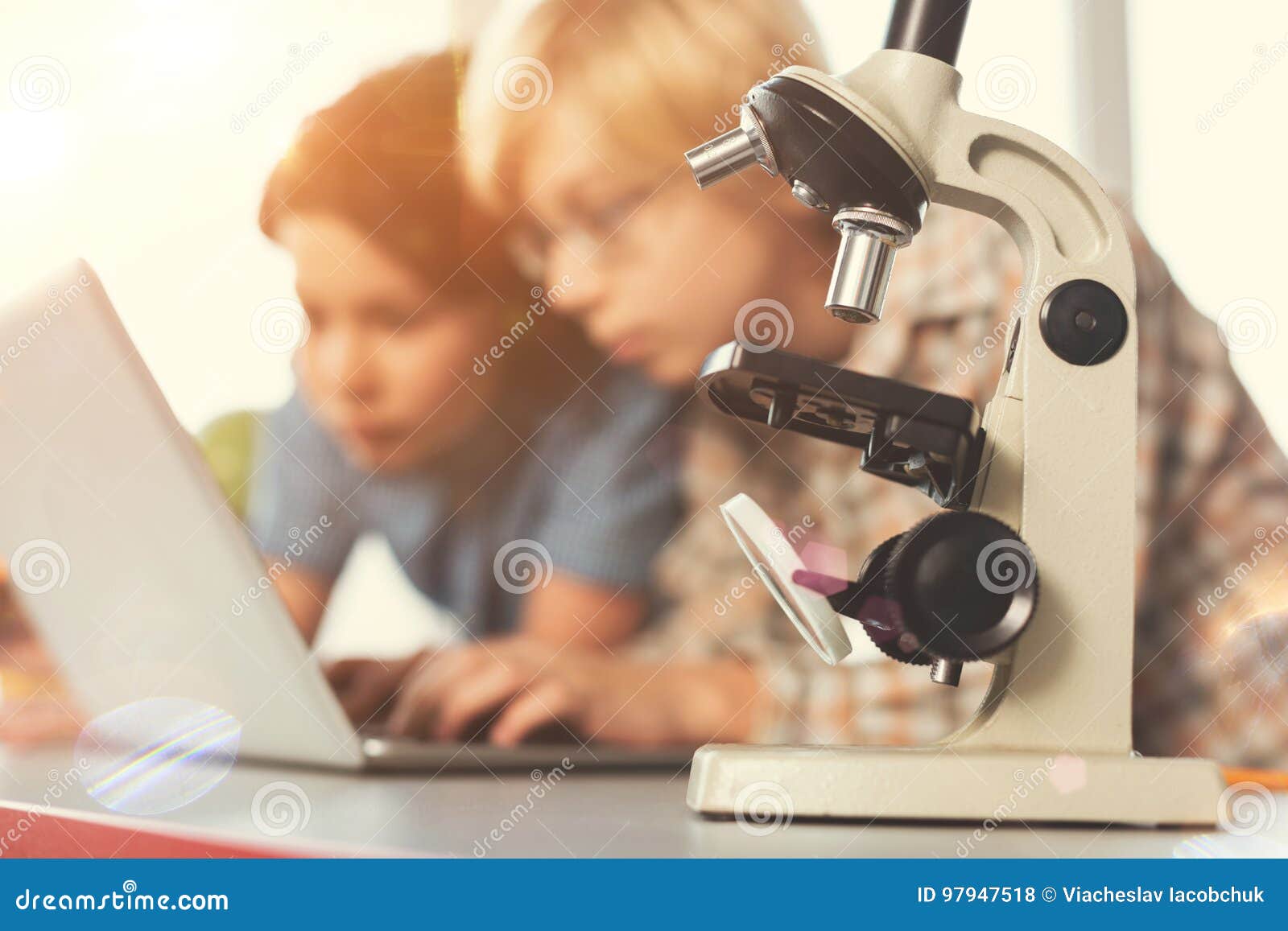 Silhouettes of Two Boys that Looking at Screen of Computer Stock Photo ...