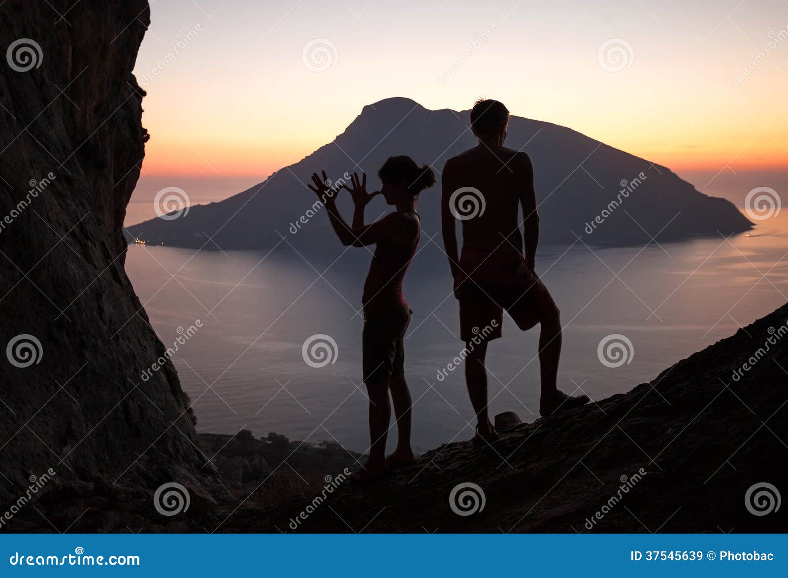 Silhouettes of Two People Having Fun at Sunset Stock Image - Image of ...