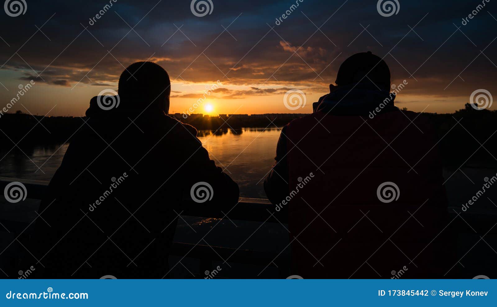 Silhouettes of Two People on a Sunset Background. Stock Photo - Image ...