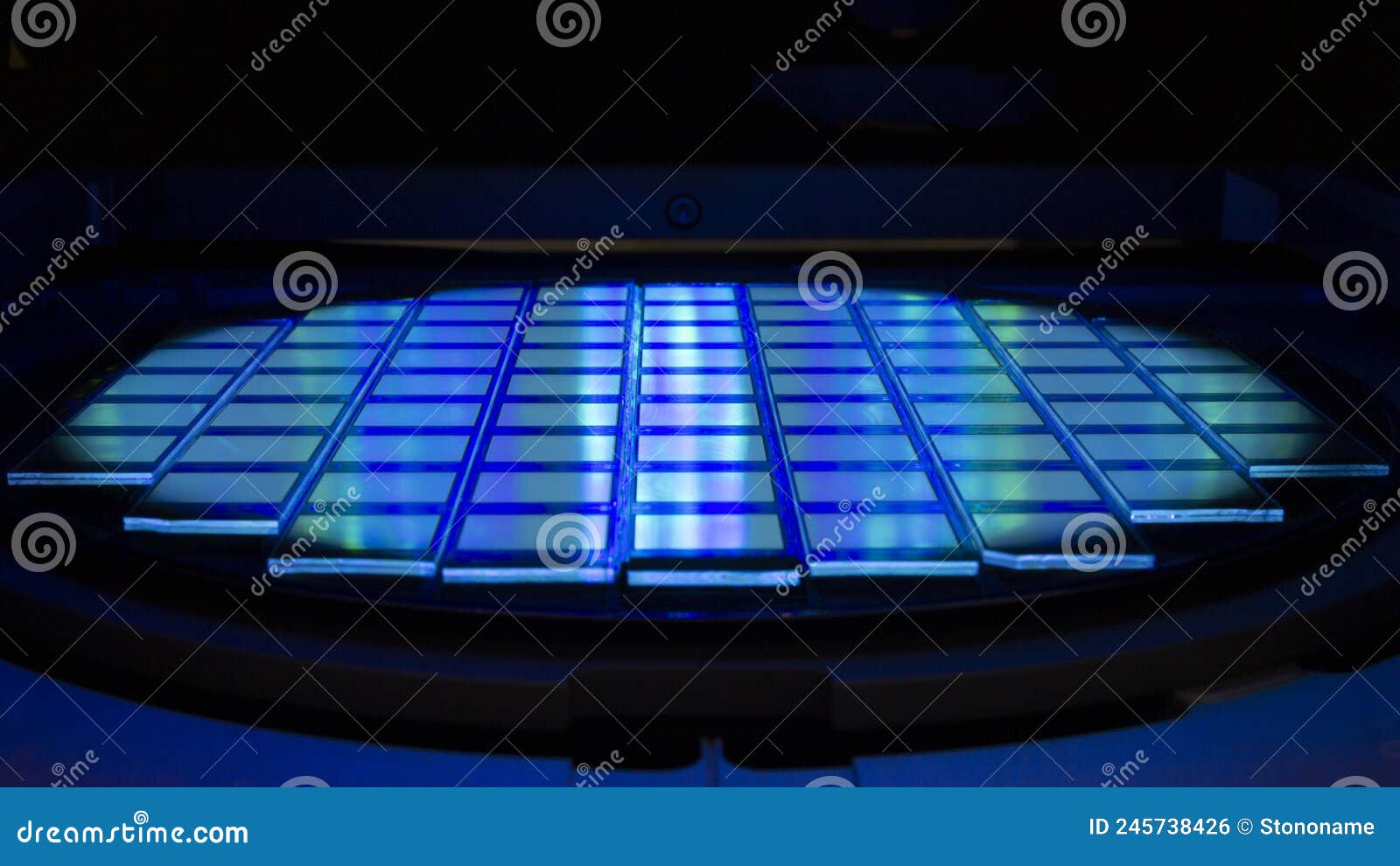 Silicon Wafer with Chips in UV Lighting. Neon. Ultraviolet Lithography ...