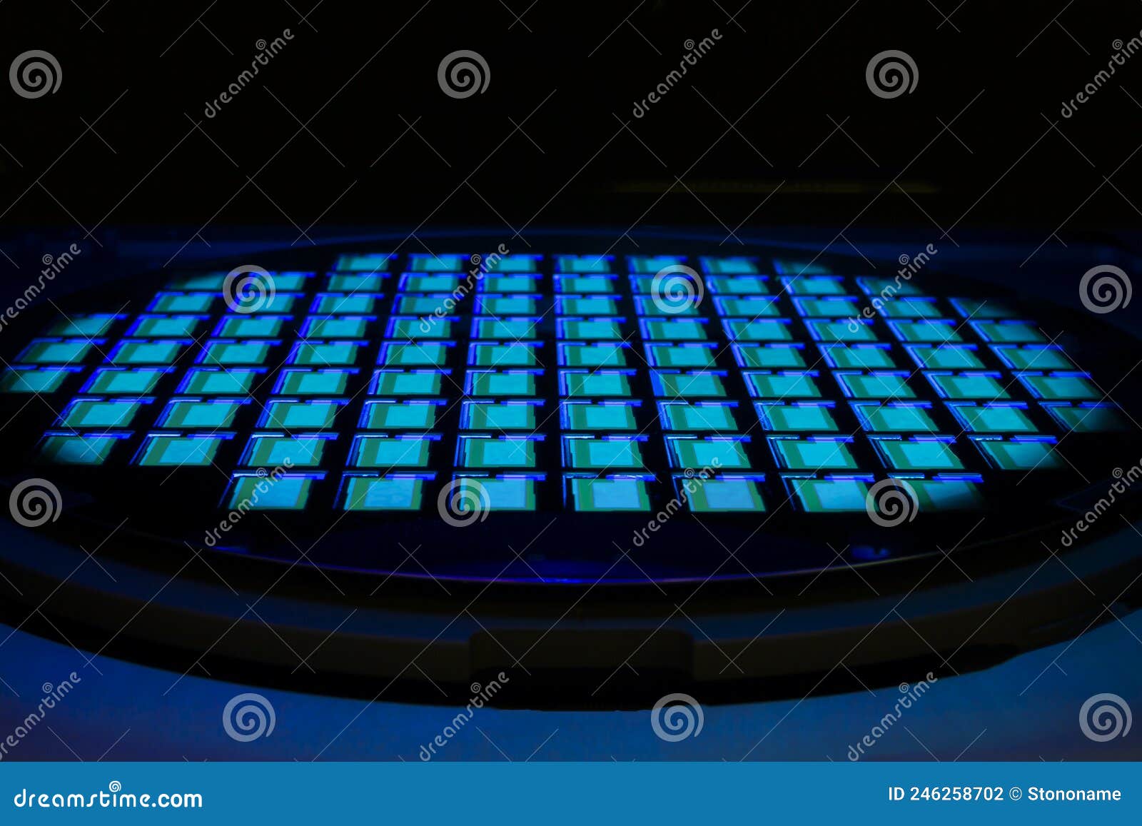 Silicon Wafer with Chips in UV Lighting. Neon. Ultraviolet Lithography ...