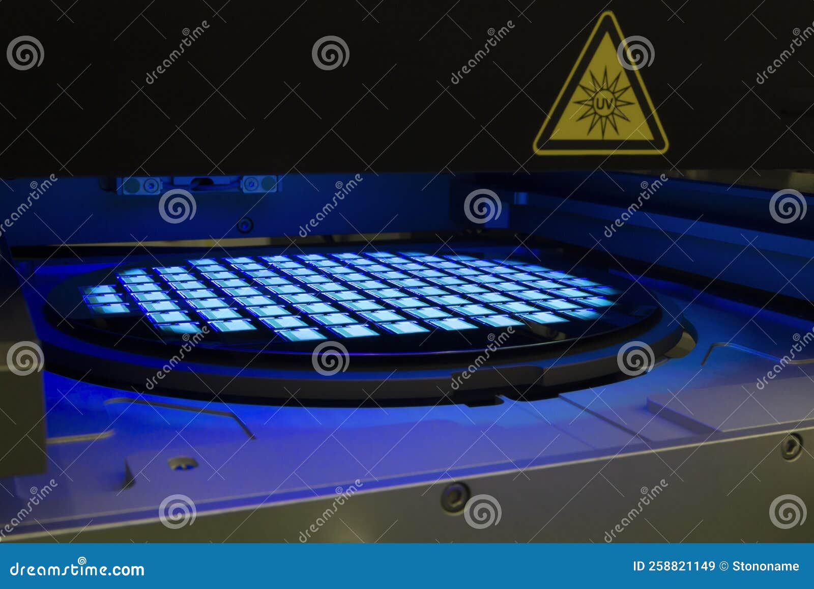 Silicon Wafer with Chips in UV Lighting. Neon. Ultraviolet Lithography ...