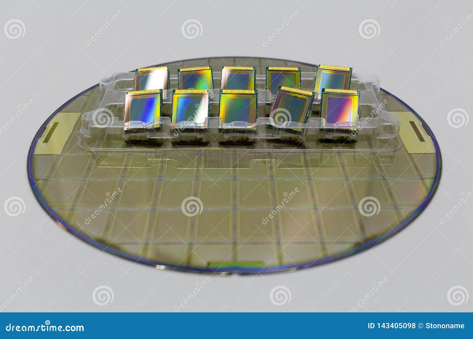 Silicon Wafers and Ready-made Microchips Lying in a Tray on the Surface ...