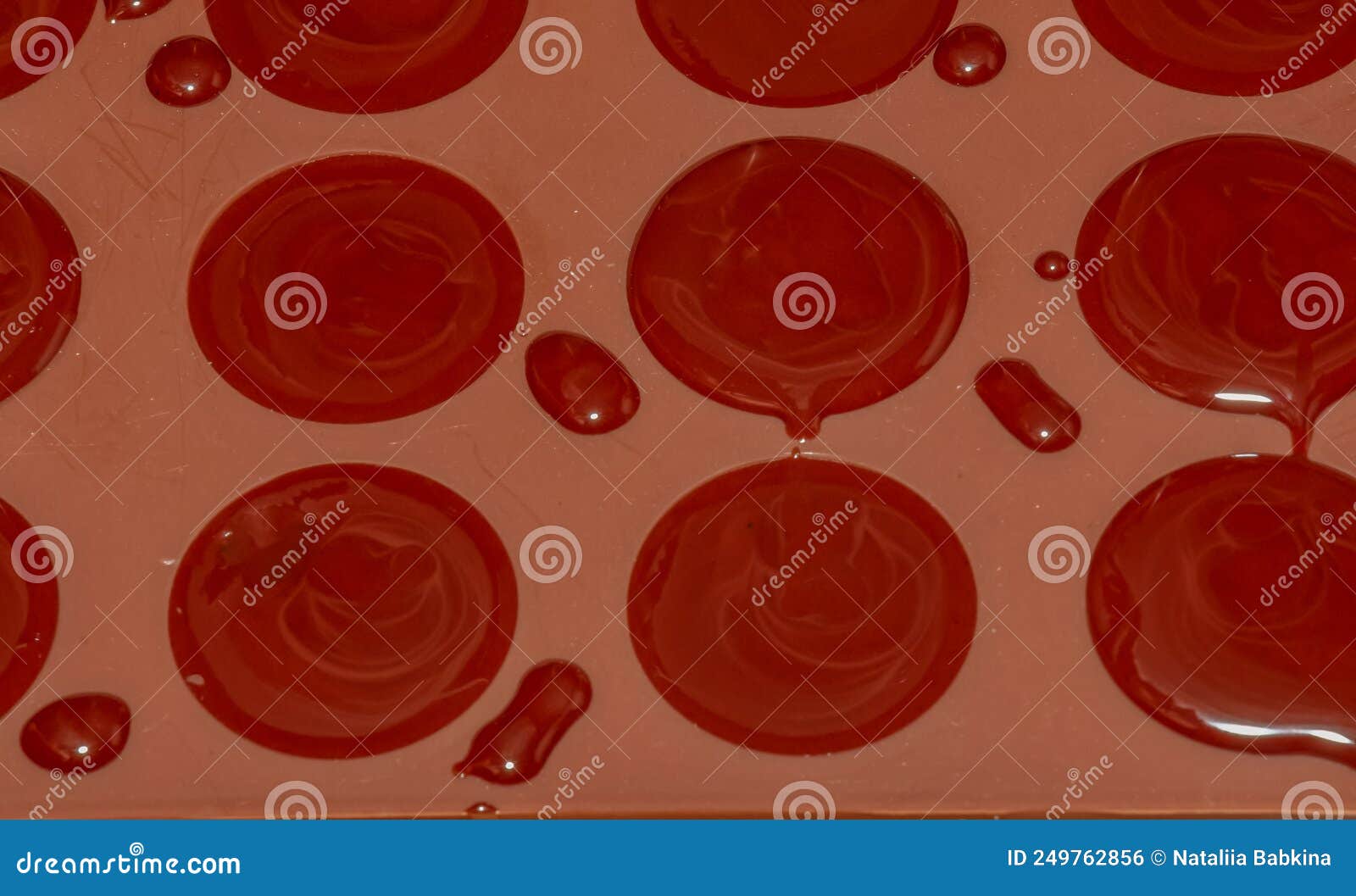 Silicone Molds for Shaping Chocolate and Sweets are Filled with Hot ...