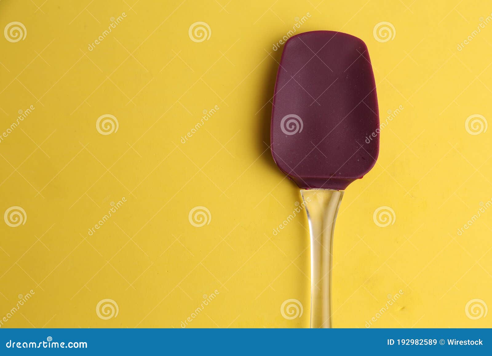 Silicone Spatula on a Yellow Surface Stock Image - Image of hold ...