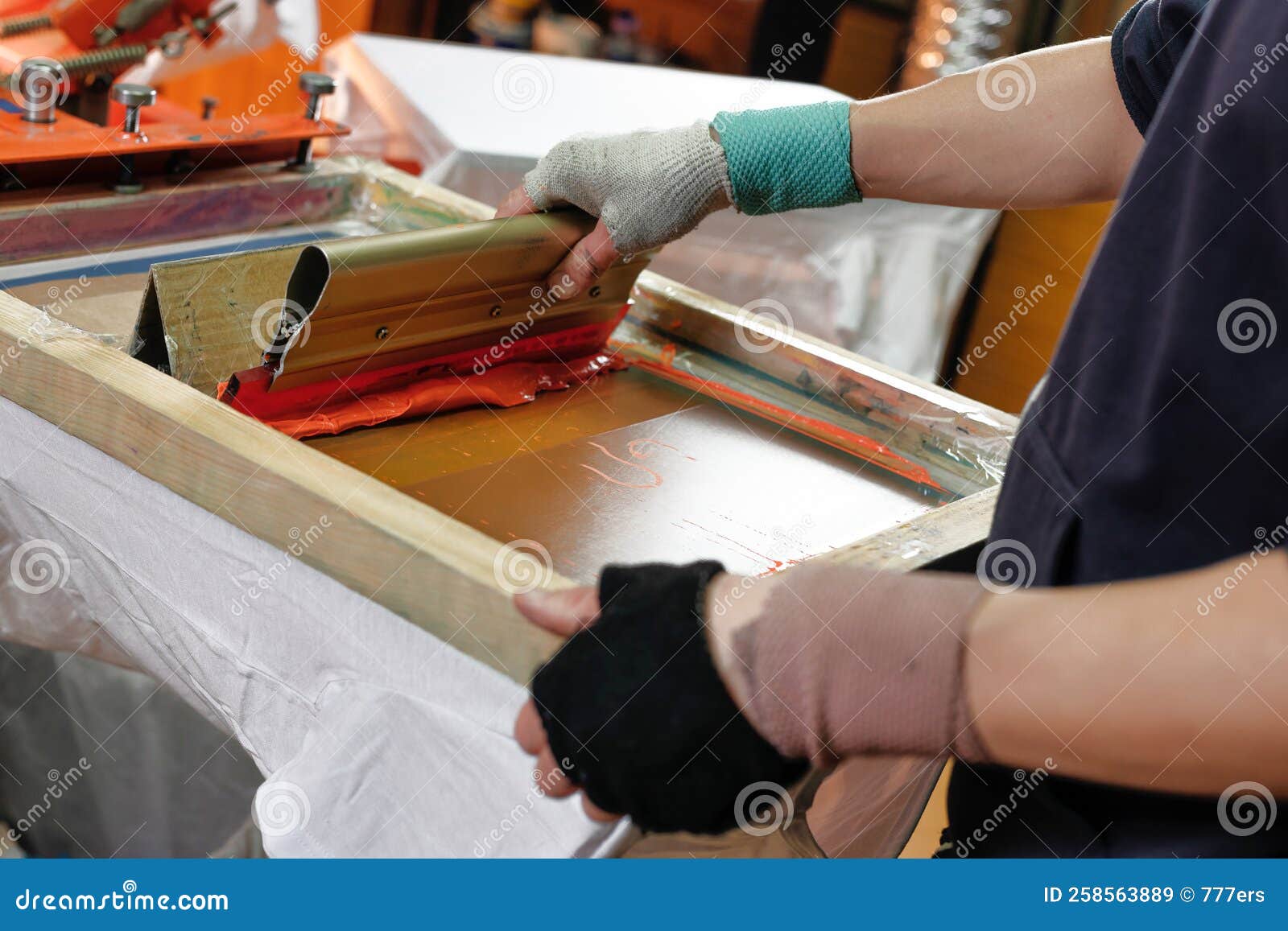 Silk Screen Printing. Male Hand with a Squeegee. Serigraphy Production ...