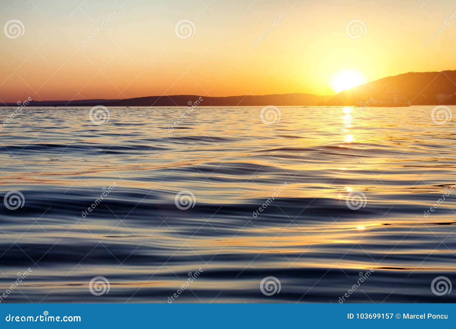 Silky Smooth Water with Sunset in the Background Stock Image - Image of ...