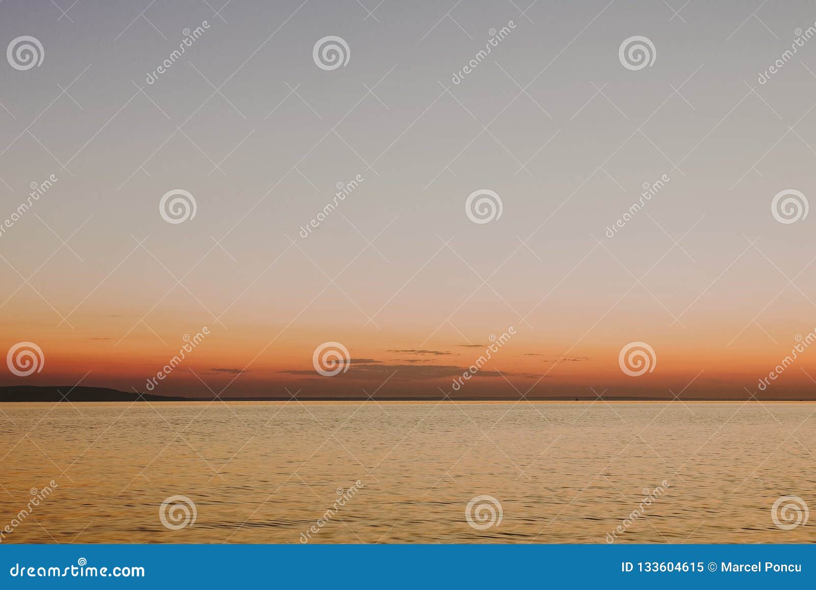 Silky Smooth Water with Sunset in Background Stock Image - Image of ...