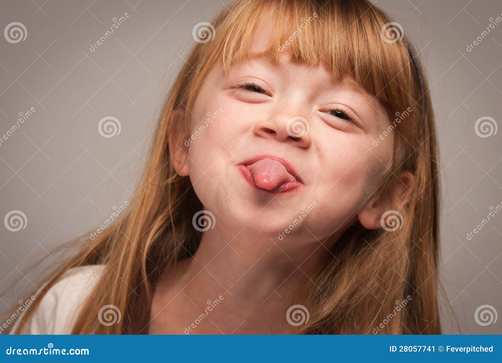 Silly Portrait of an Adorable Red Haired Girl on Grey Stock Image ...