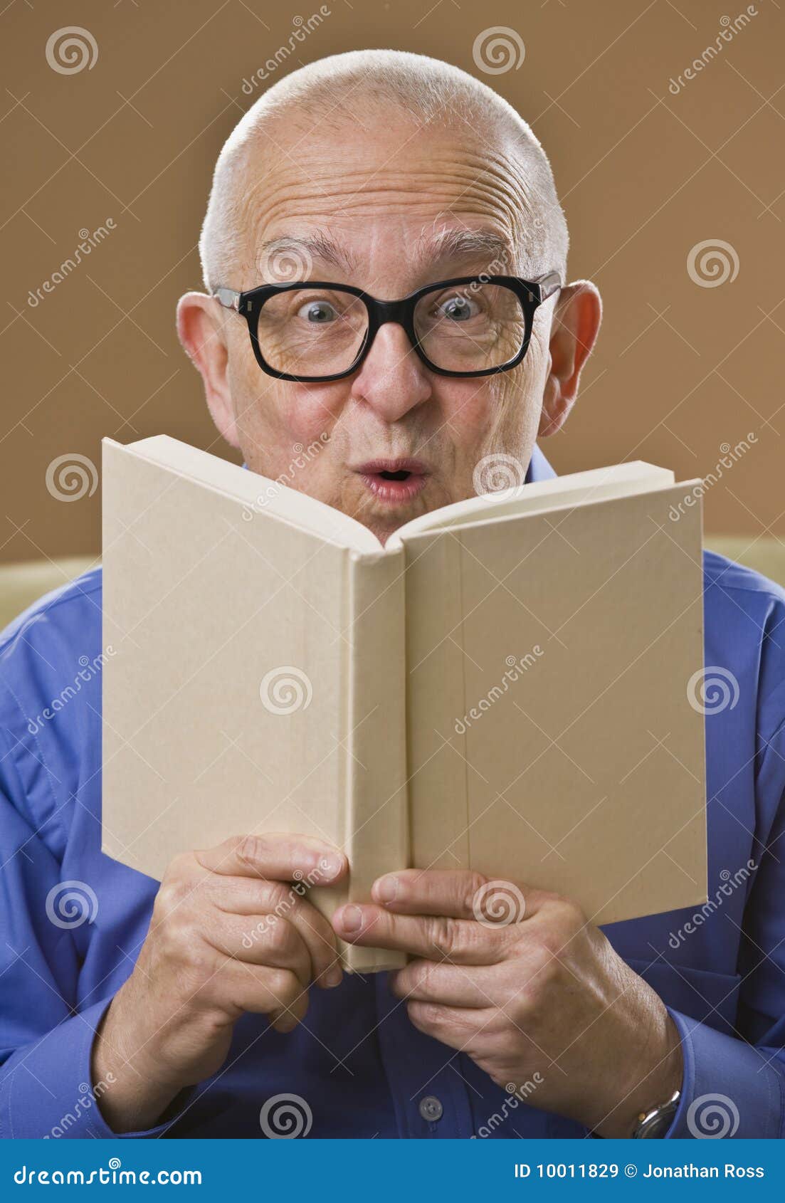 Silly Senior Man Reading Book. Stock Image - Image of handsome ...