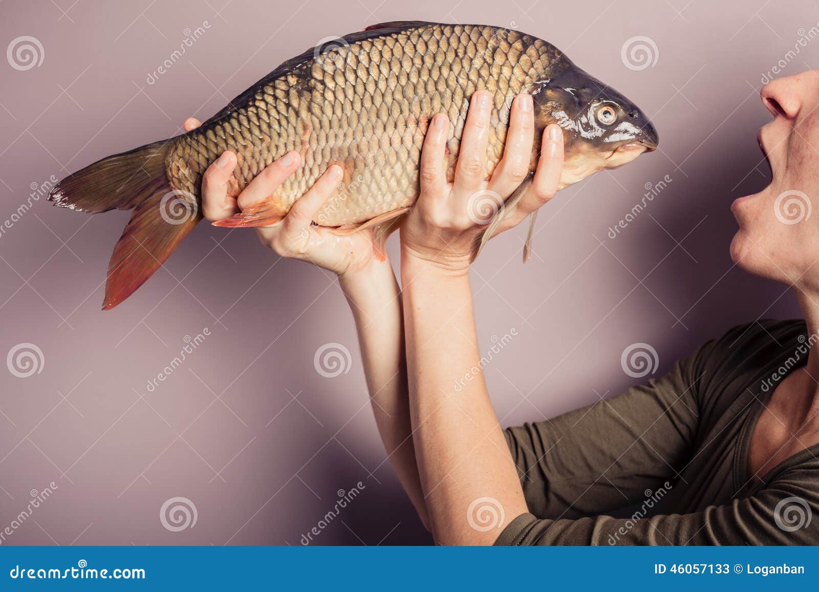 Silly Young Woman Posing with a Carp Stock Image - Image of recreation ...