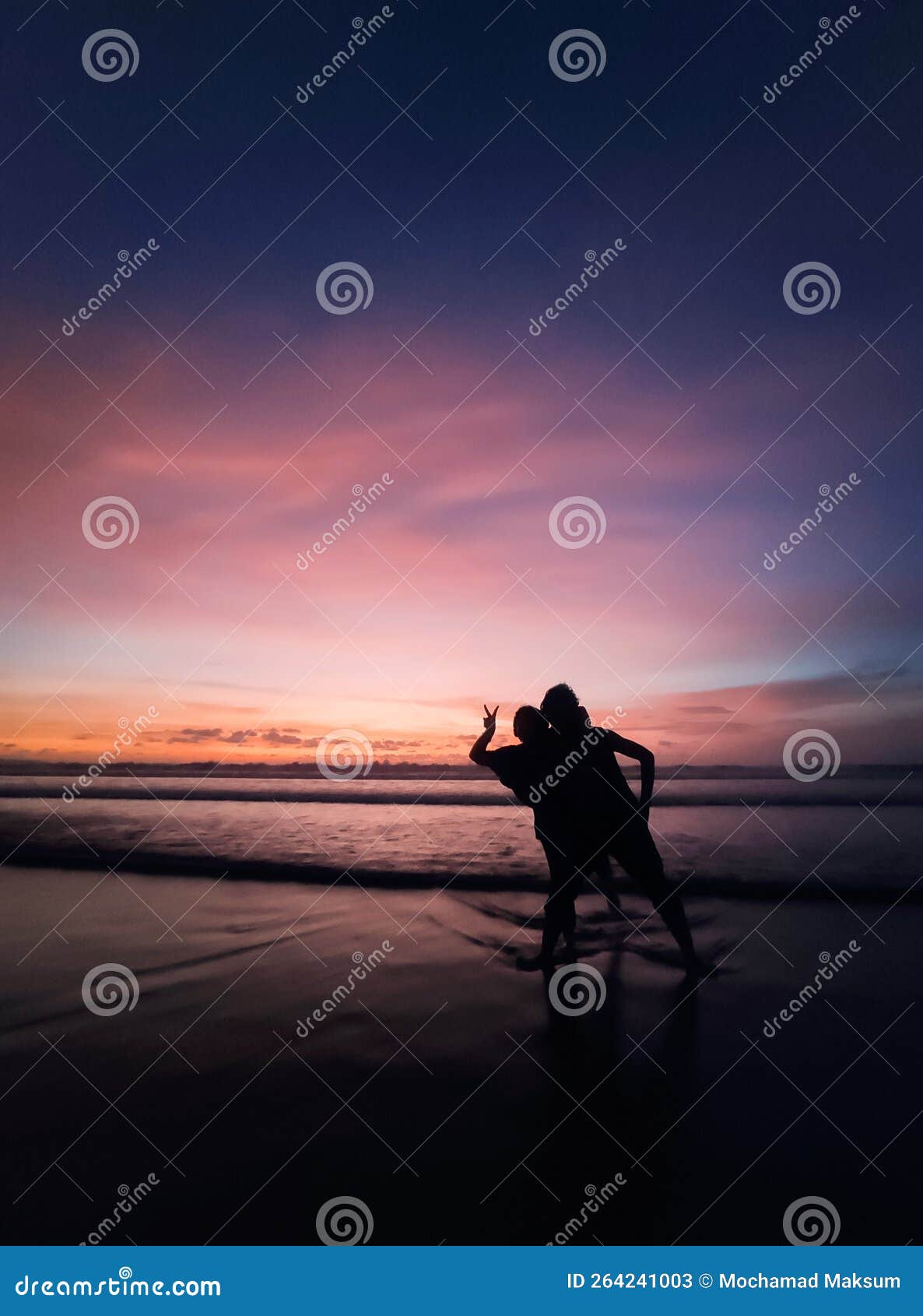Silouette of Beachgoers Watching the Sunset with a Very Beautiful Sky ...
