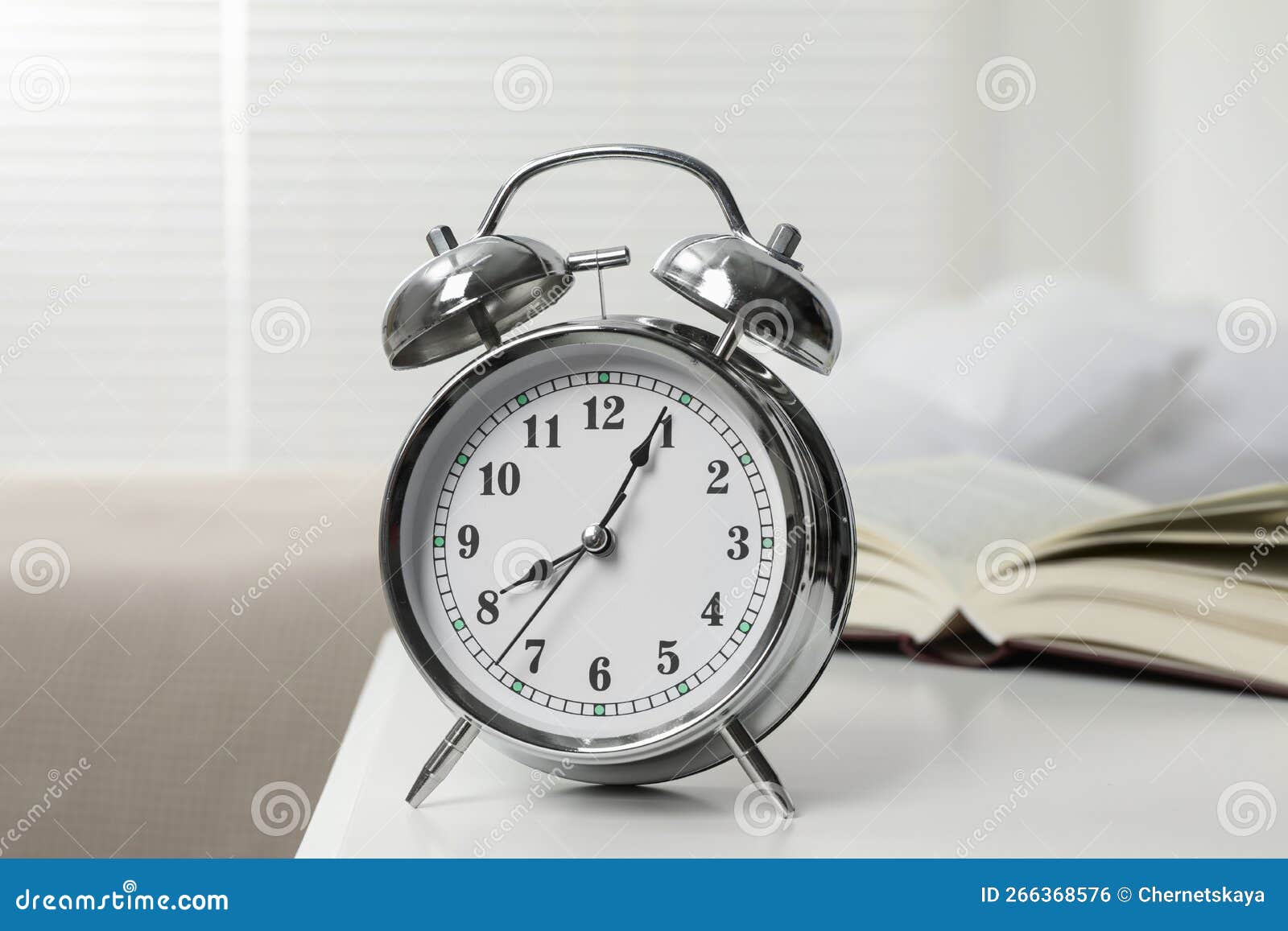 Silver Alarm Clock on White Nightstand in Bedroom Stock Photo - Image ...