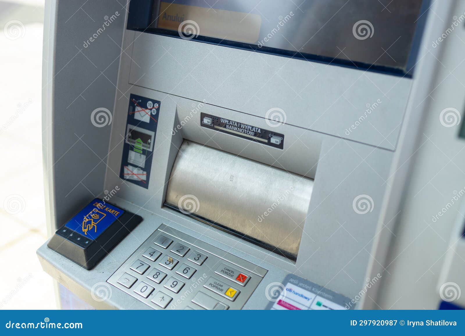 Silver Automatic Teller Machine Hanging on a Gray Concrete Wall ...