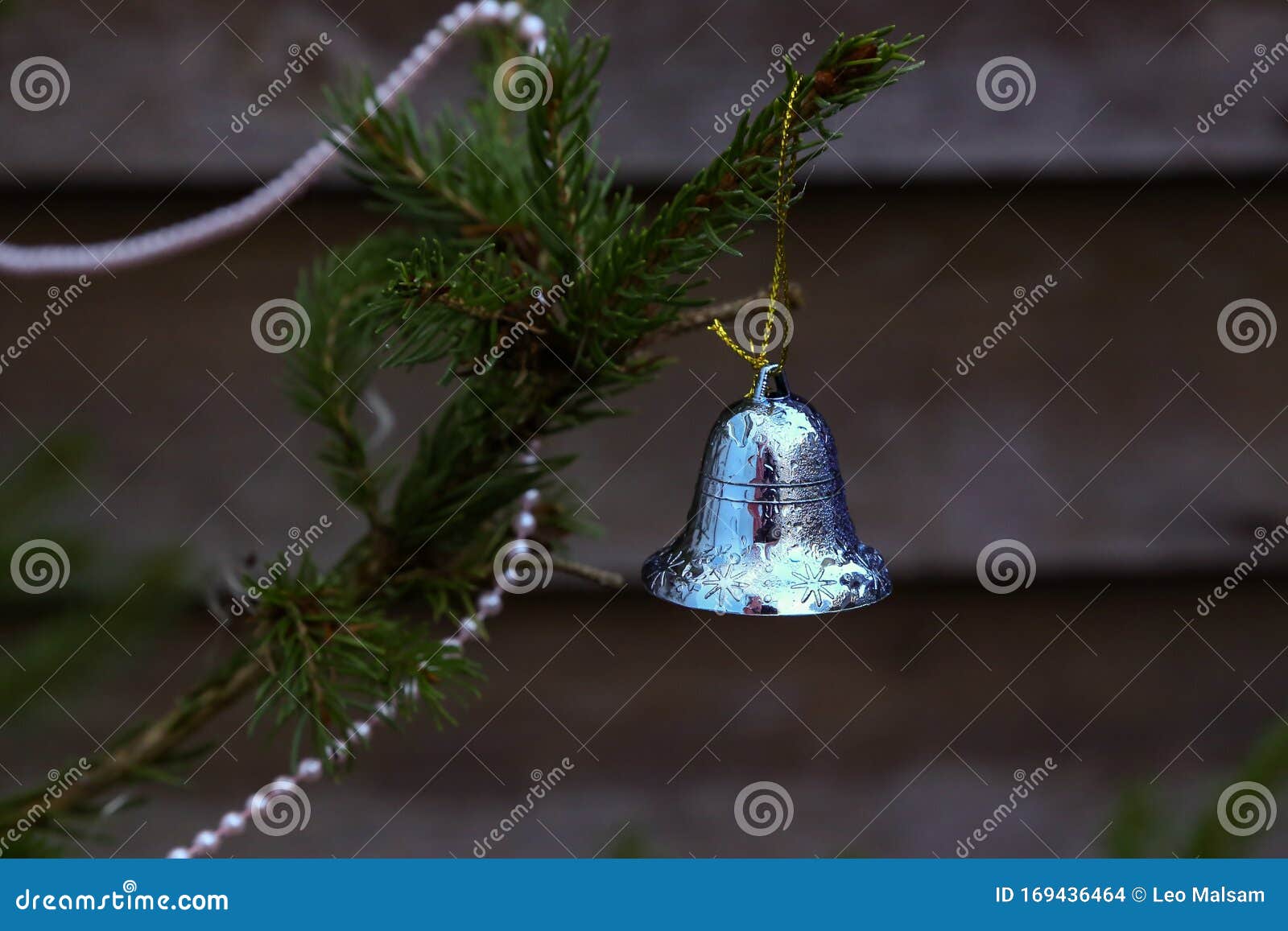 Silver Bell Hanging on a Christmas Tree Stock Photo - Image of blue ...