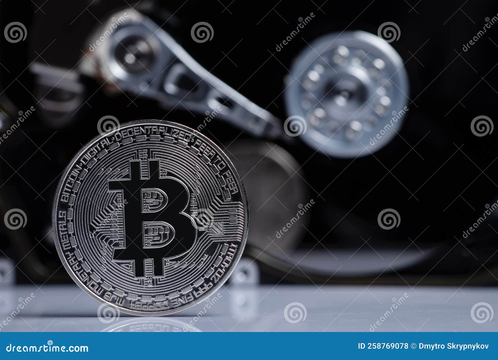 Silver Bitcoin Coin on Background the Opened HDD Disk. Electronic Money ...