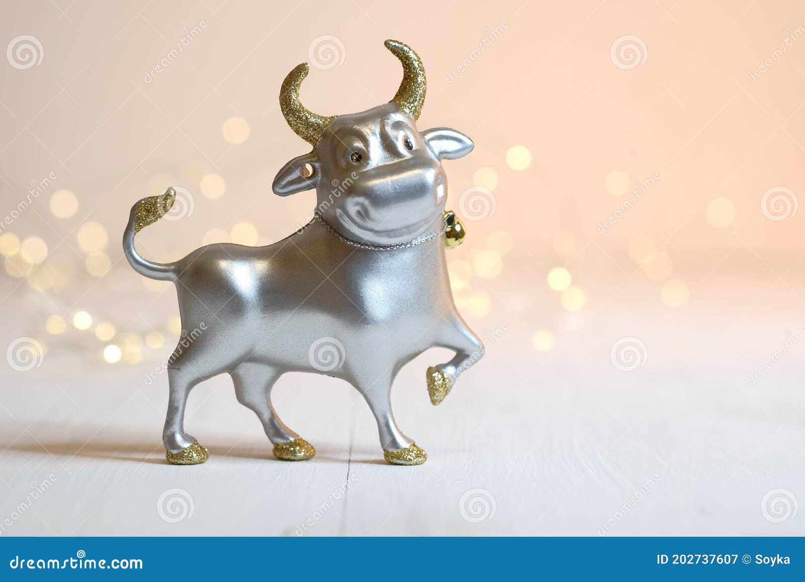A Silver Bull Stands on a White Table Stock Image - Image of gift, wood ...